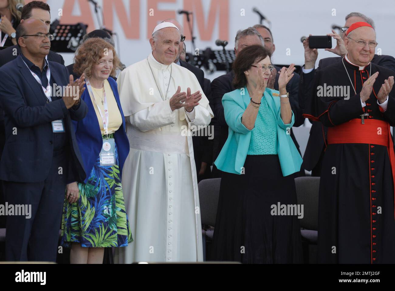 Pope Francis, center, claps his hands as he arrives to lead a Pentecost ...