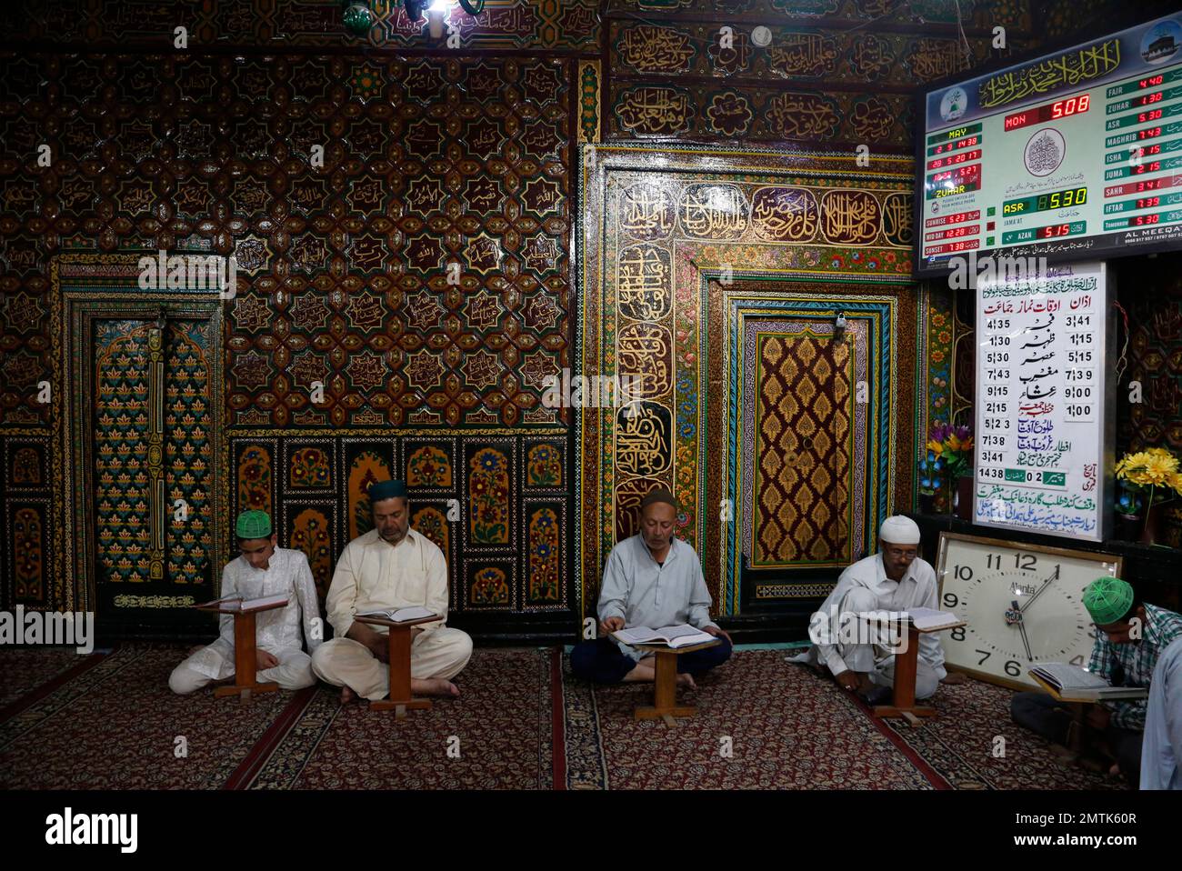 Kashmiri Muslims read verses from the Quran, Islam's holy book, inside ...