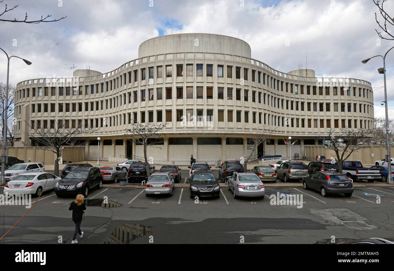 FILE – In this Feb. 27, 2013, photo, a woman crosses the parking lot to ...