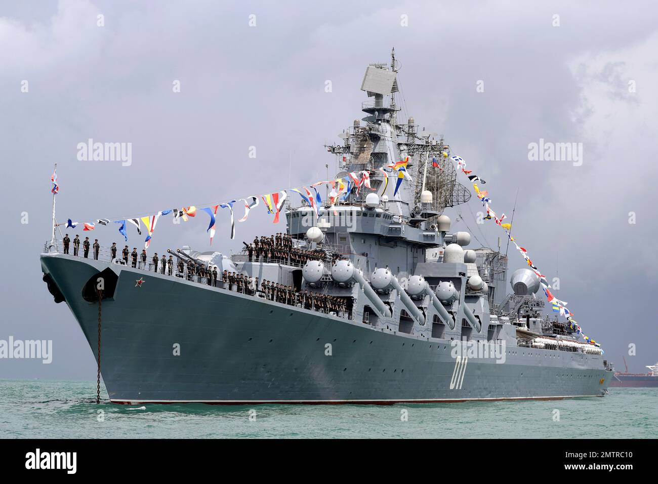 Russian navy officers stand on their guided missile cruiser Varyag ...
