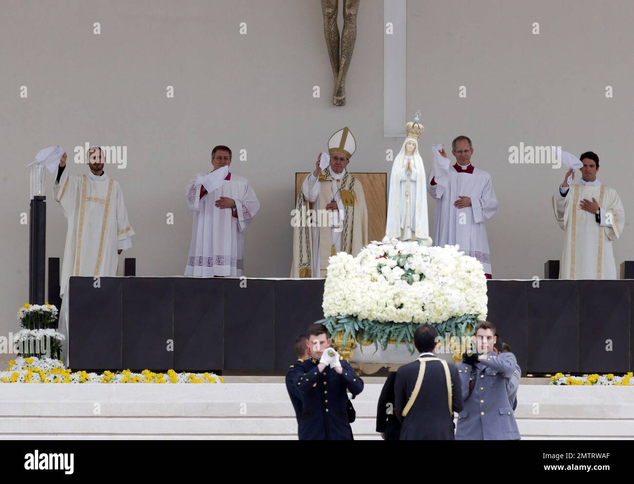 Pope Francis, center, waves a white handkerchiefs as the statue of Our ...