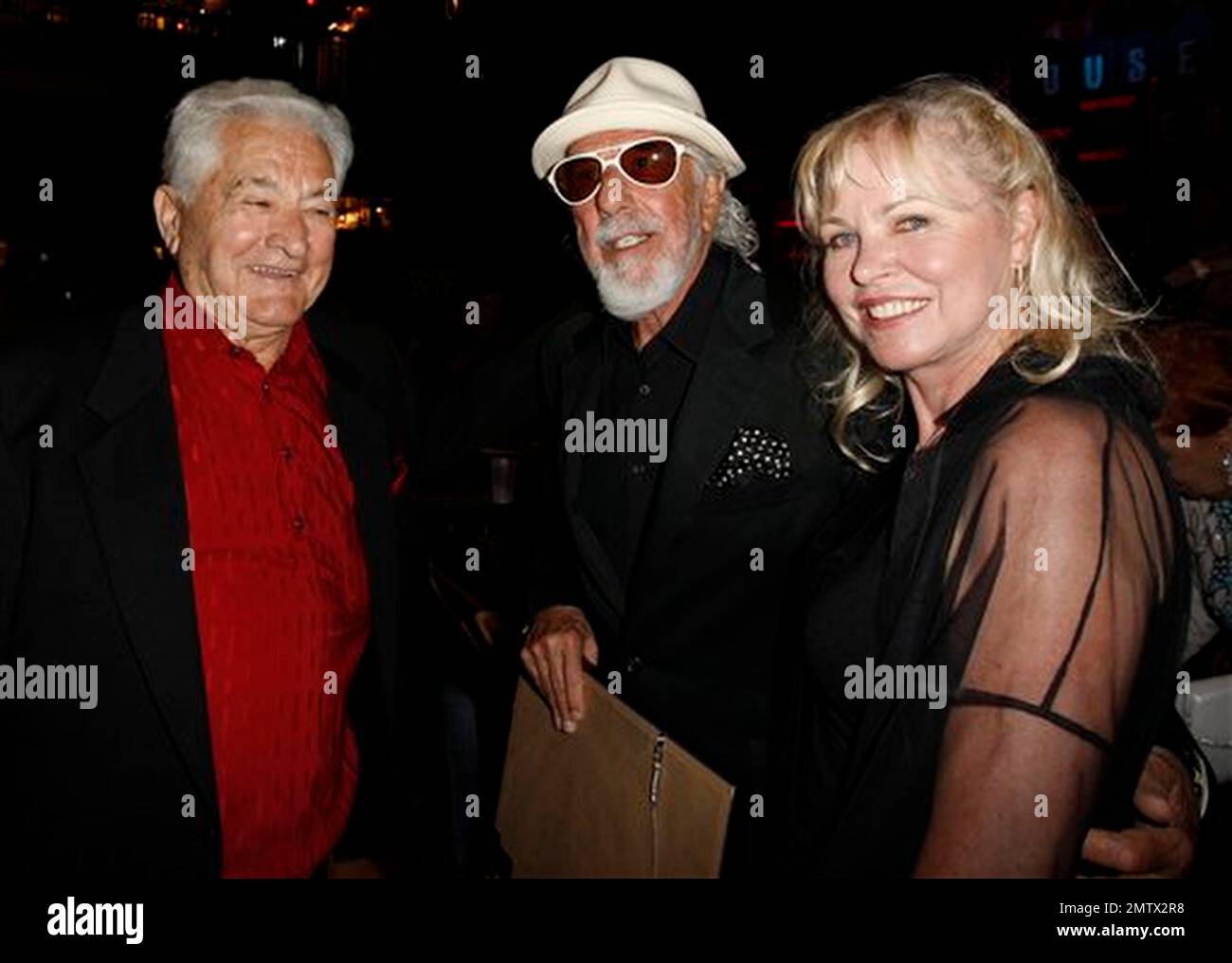 FILE - In this June 26, 2008 file photo Lou Adler, center, is joined by ...
