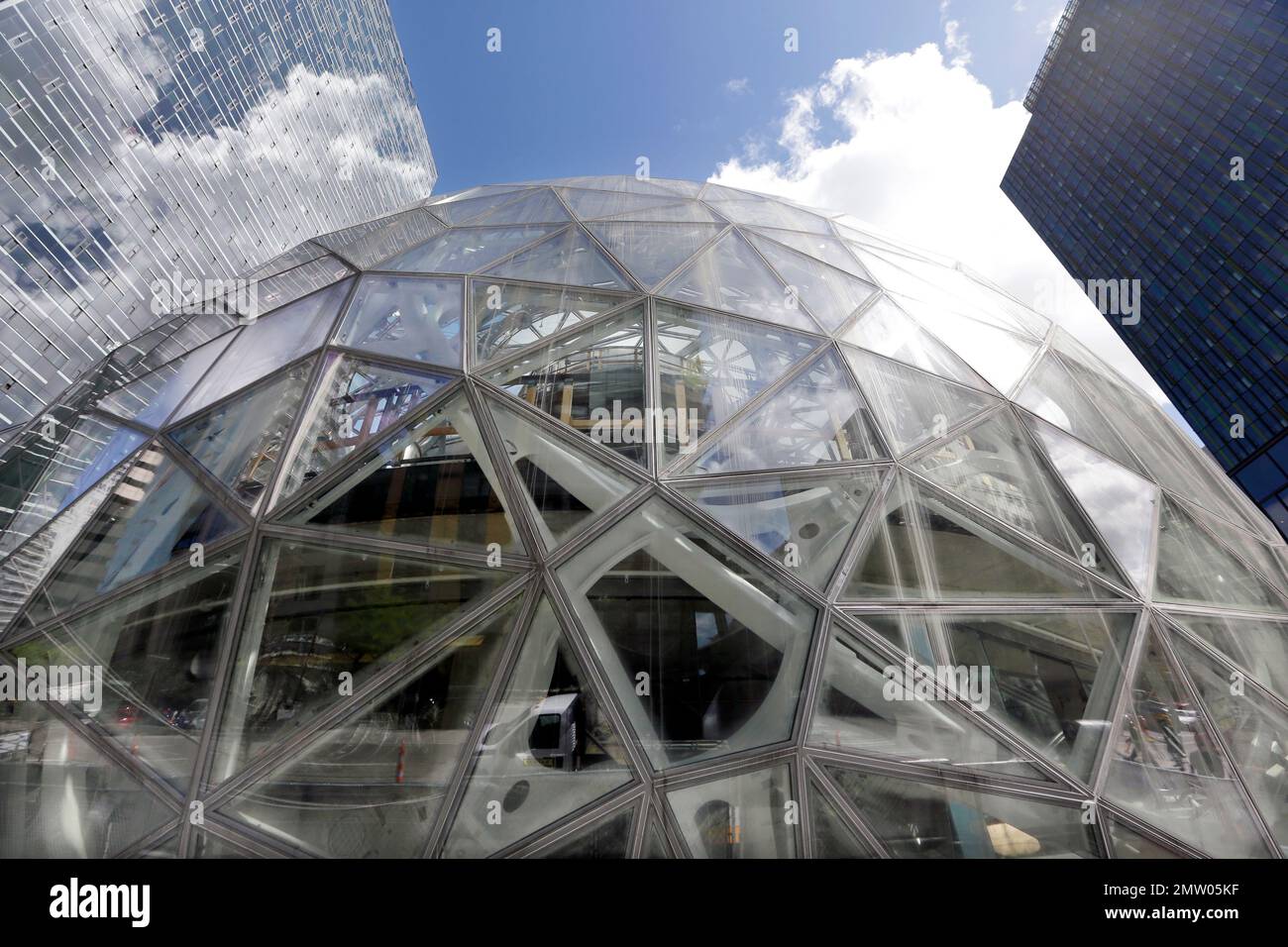 Construction continues on three large, glass-covered domes as part of ...