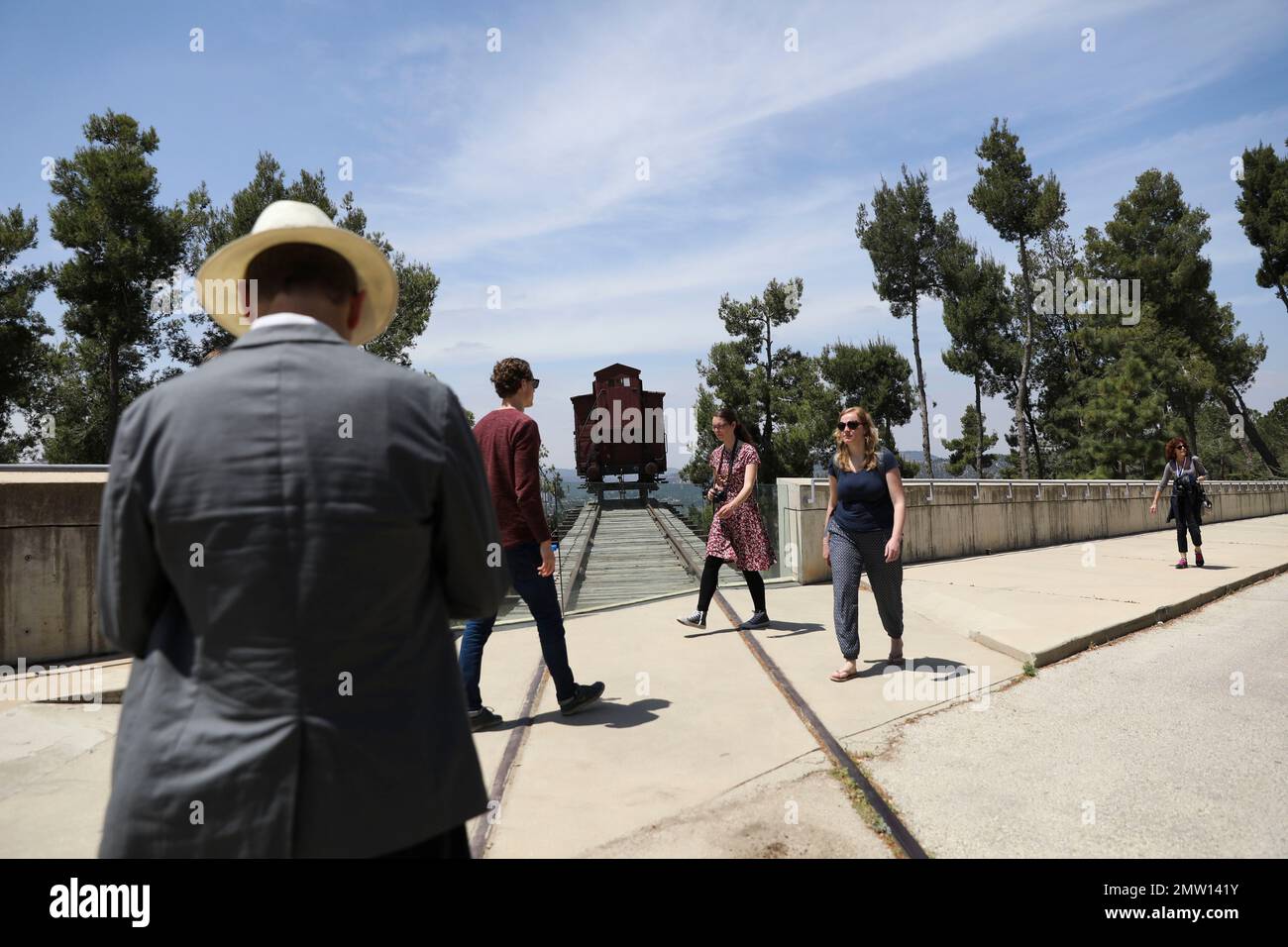 People walk past Auschwitz train wagon during a remembrance day in Yad ...