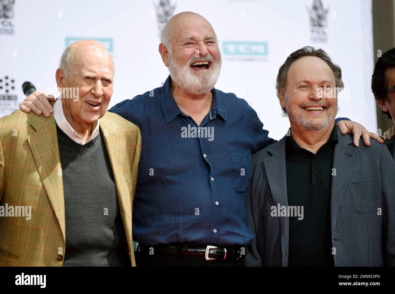 Carl Reiner, left, and his son Rob Reiner, center, pose with guest ...
