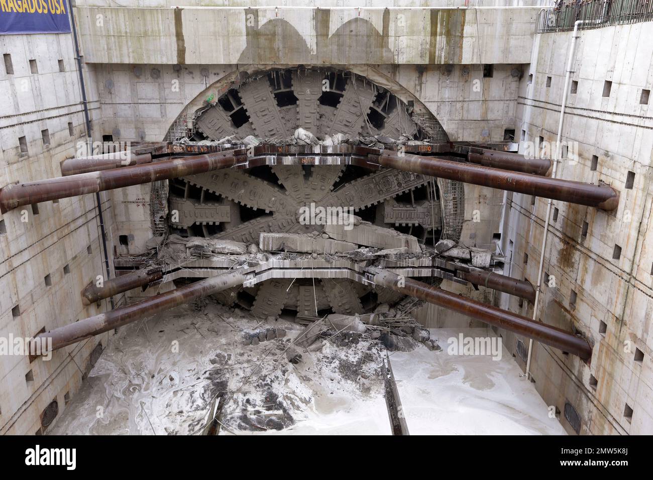 The front of a massive tunneling machine is visible after breaking ...