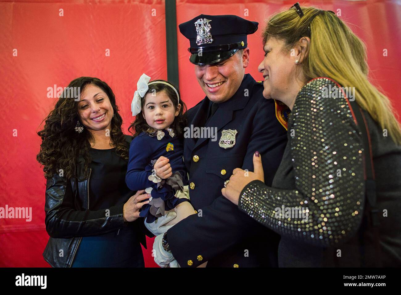 Matias Ferreira, center, celebrates with his 2-year-old daughter, his ...