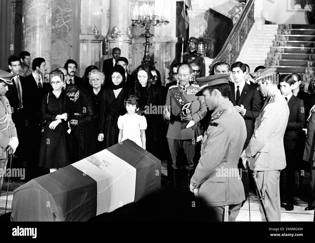 President Anwar Sadat of Egypt leads the former Shah's family in prayer ...
