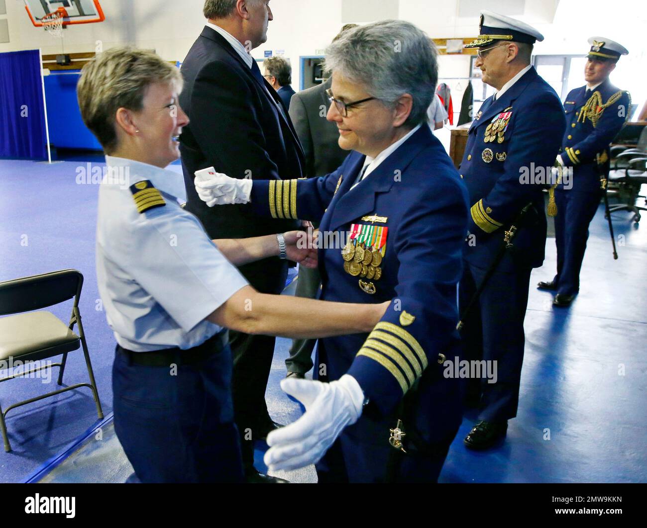 Capt. Linda Sturgis, center, the new commander of the U.S. Coast Guard ...