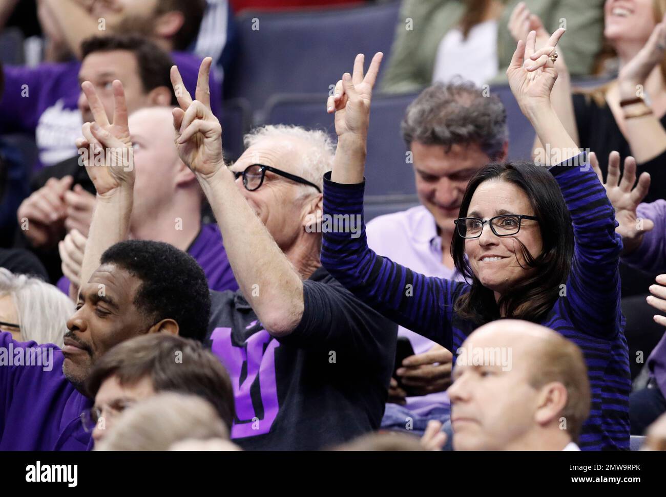 Actress Julia Louis-Dreyfus, center, reacts during the first half of an ...