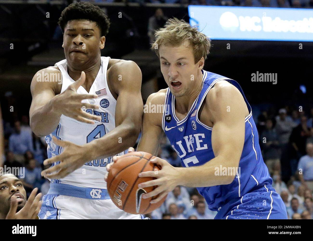 North Carolina's Isaiah Hicks, left, and Duke's Luke Kennard struggle ...