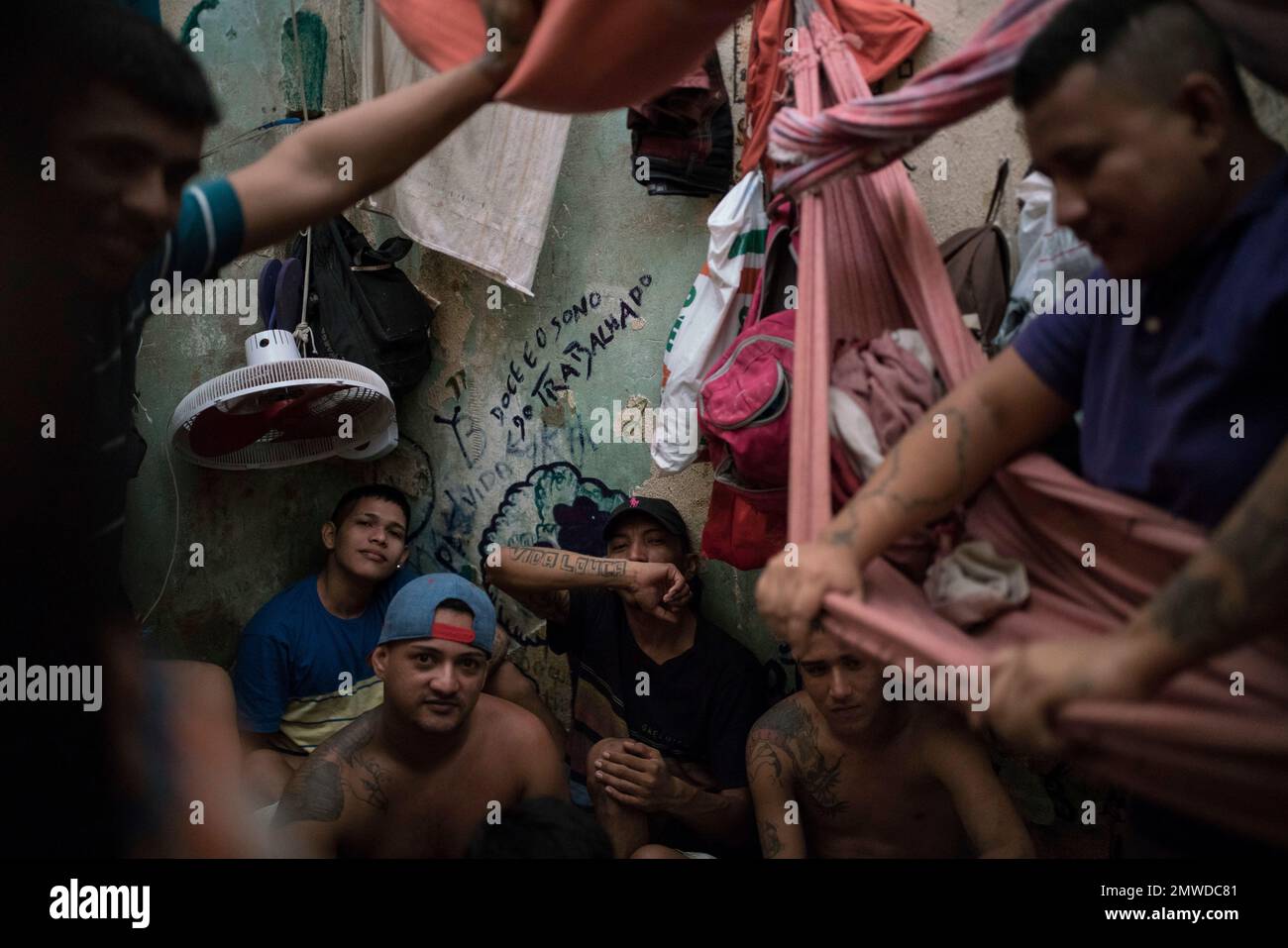 In this Feb. 6, 2017 photo, detainees sit inside an overcrowded cell at ...