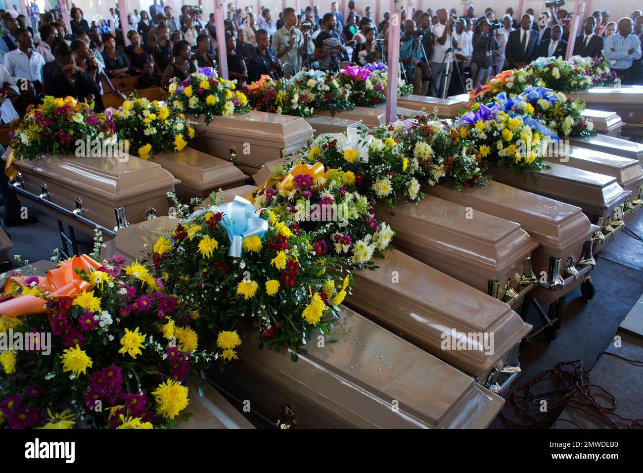 Coffins containing inmates bodies lay inside St. Anne church during the ...