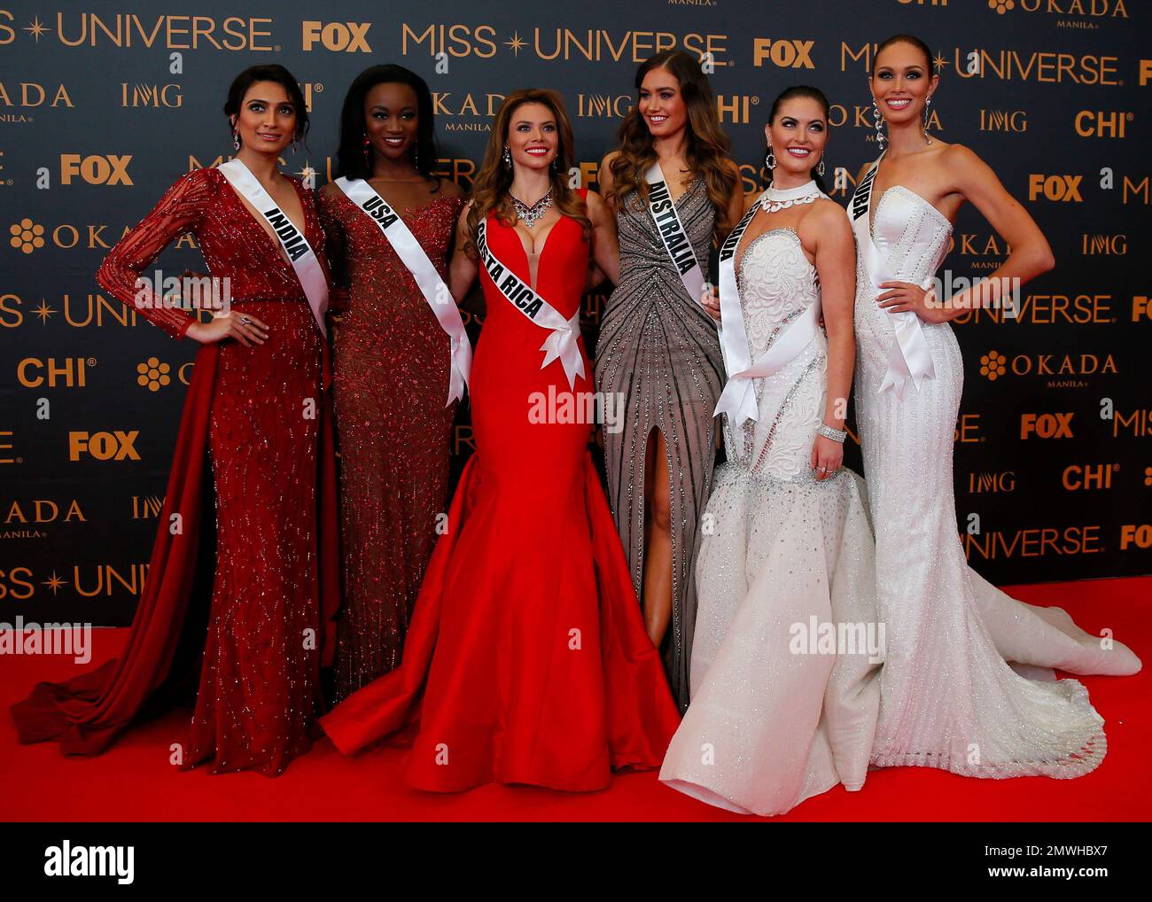 Miss Universe contestants pose on the red carpet on the eve of their ...