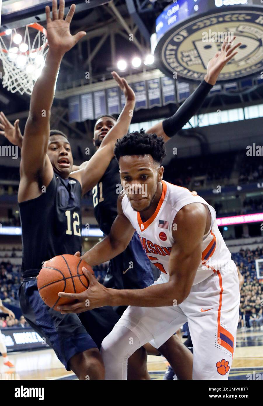 Pittsburgh's Chris Jones (12) and Sheldon Jeter (21) defend as Clemson ...