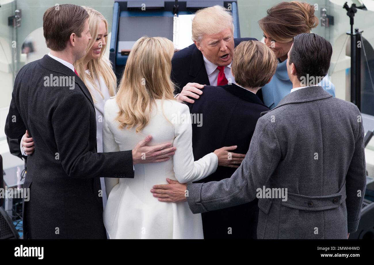 Donald Trump is greets his family after being sworn in as the 45th ...