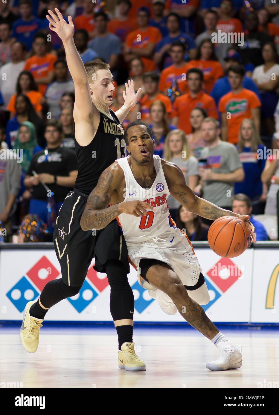 Florida guard Kasey Hill (0) dribbles past Vanderbilt guard Riley ...