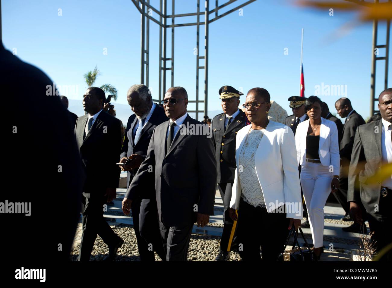 Haiti's Interim President Jocelerme Privert, center, arrives with his ...