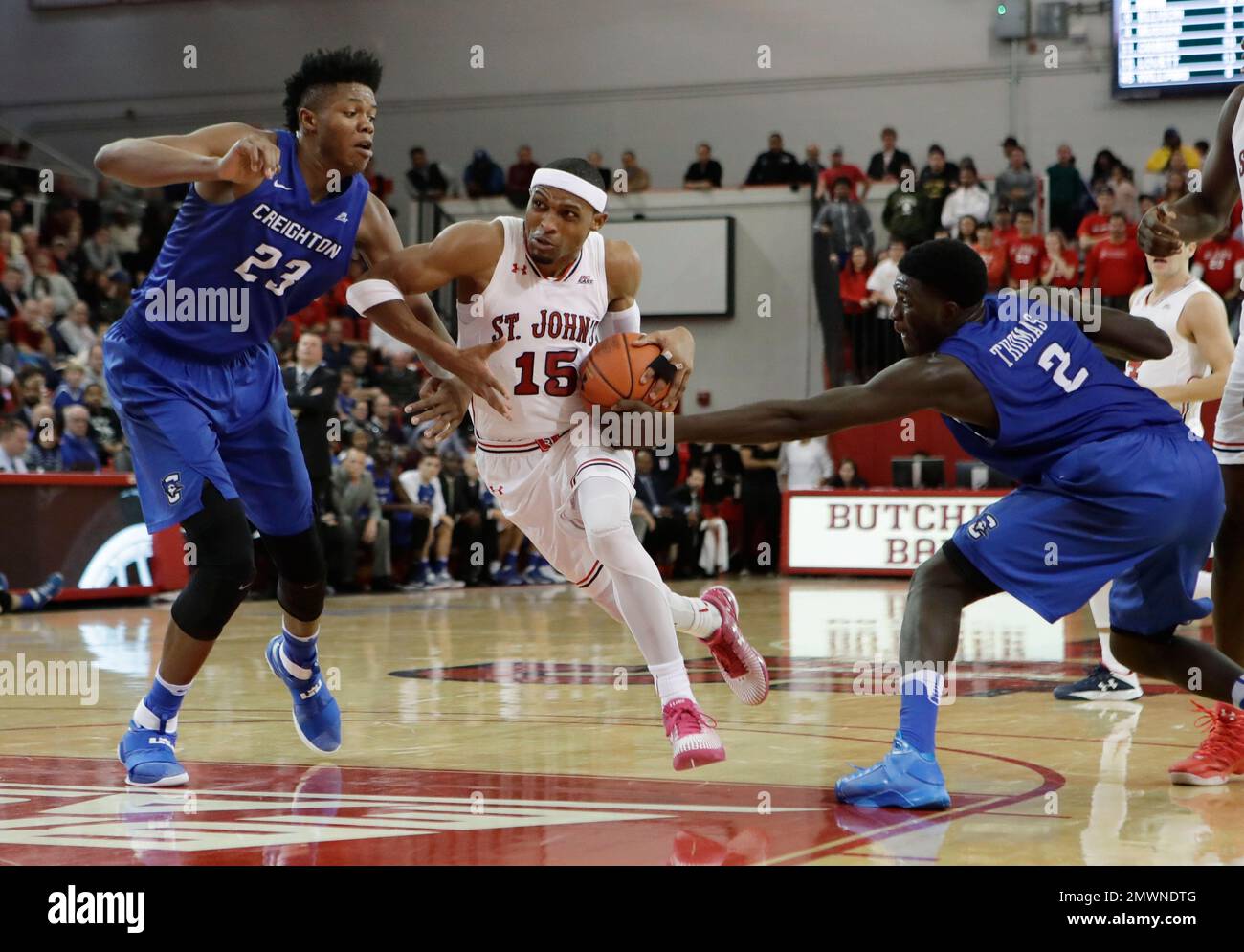 St. John's Marcus LoVett (15) drives past Creighton's Justin Patton (23 ...