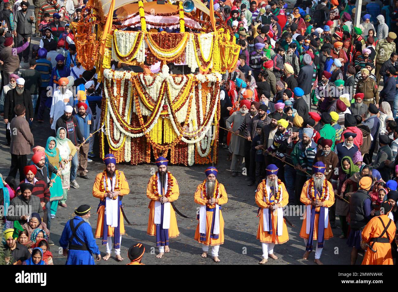 Indian Sikhs dressed as Panj Pyare, or five beloved ones, walk in a ...