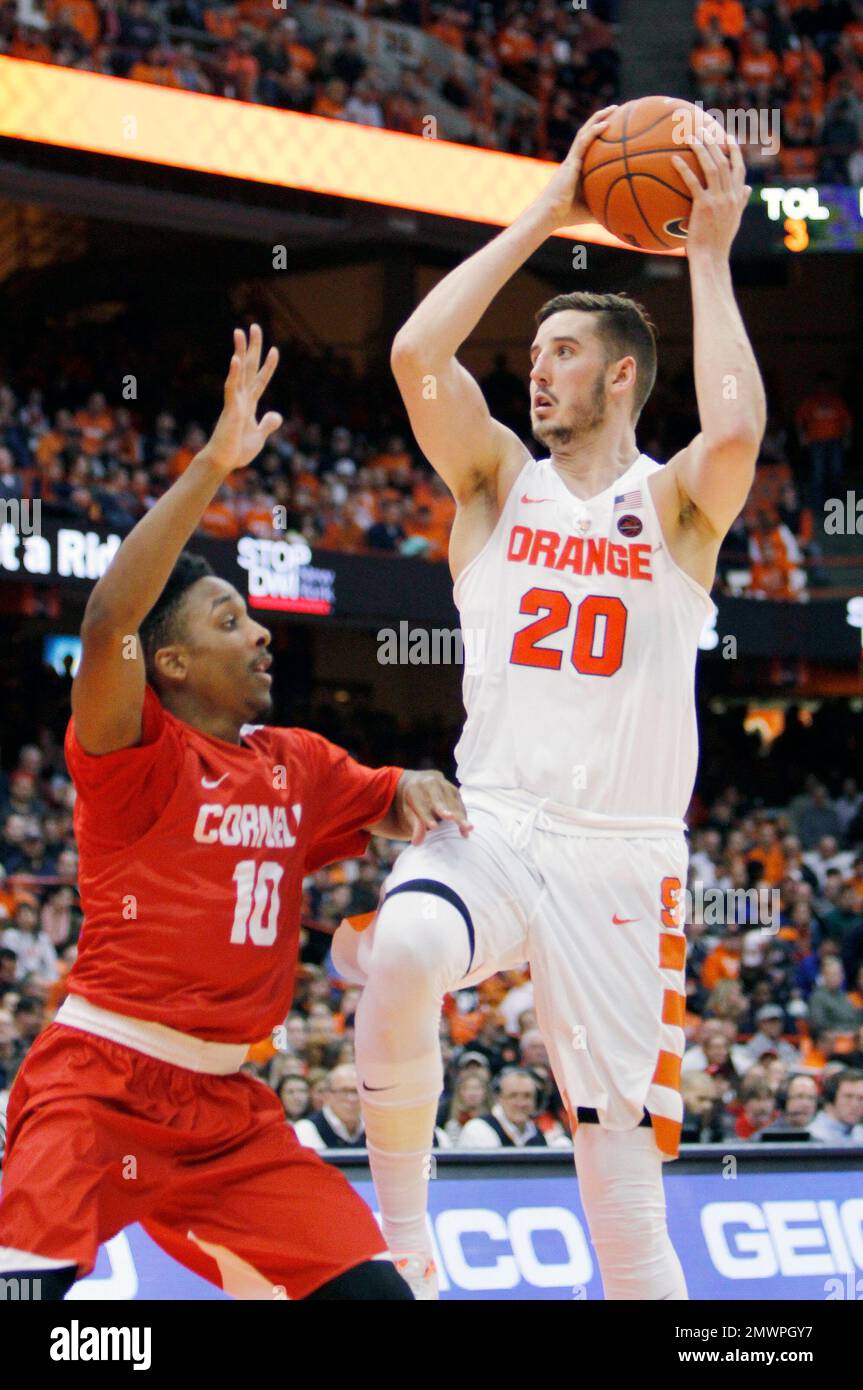 Syracuse's Tyler Lydon, right, shoots over Cornell's Matt Morgan, left ...