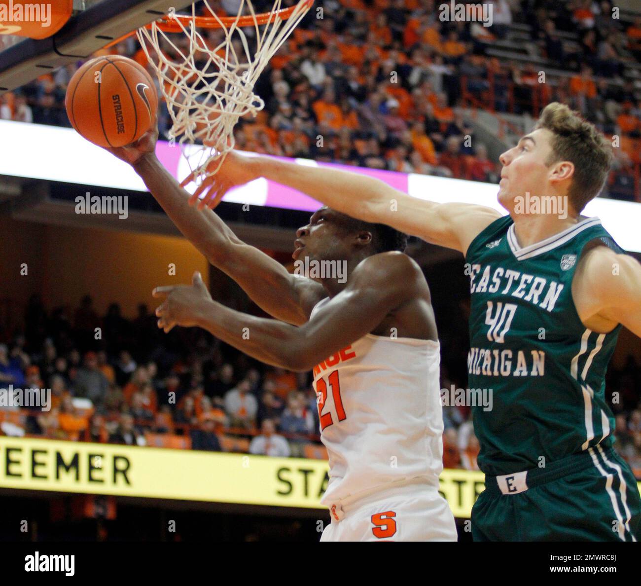 Syracuse's Tyler Roberson, left, shoots against Eastern Michigan's ...