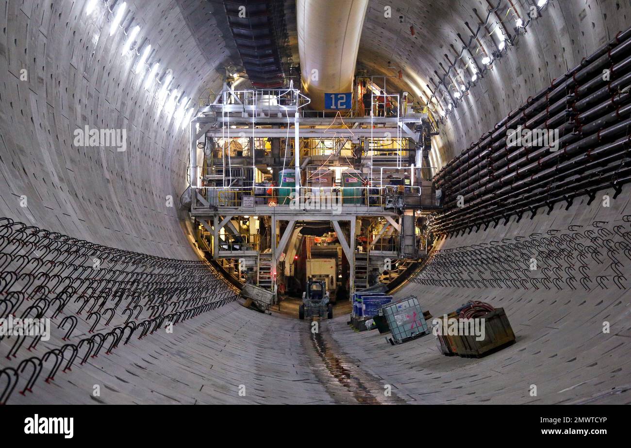 The back of a massive drilling machine is decorated with lights as it ...