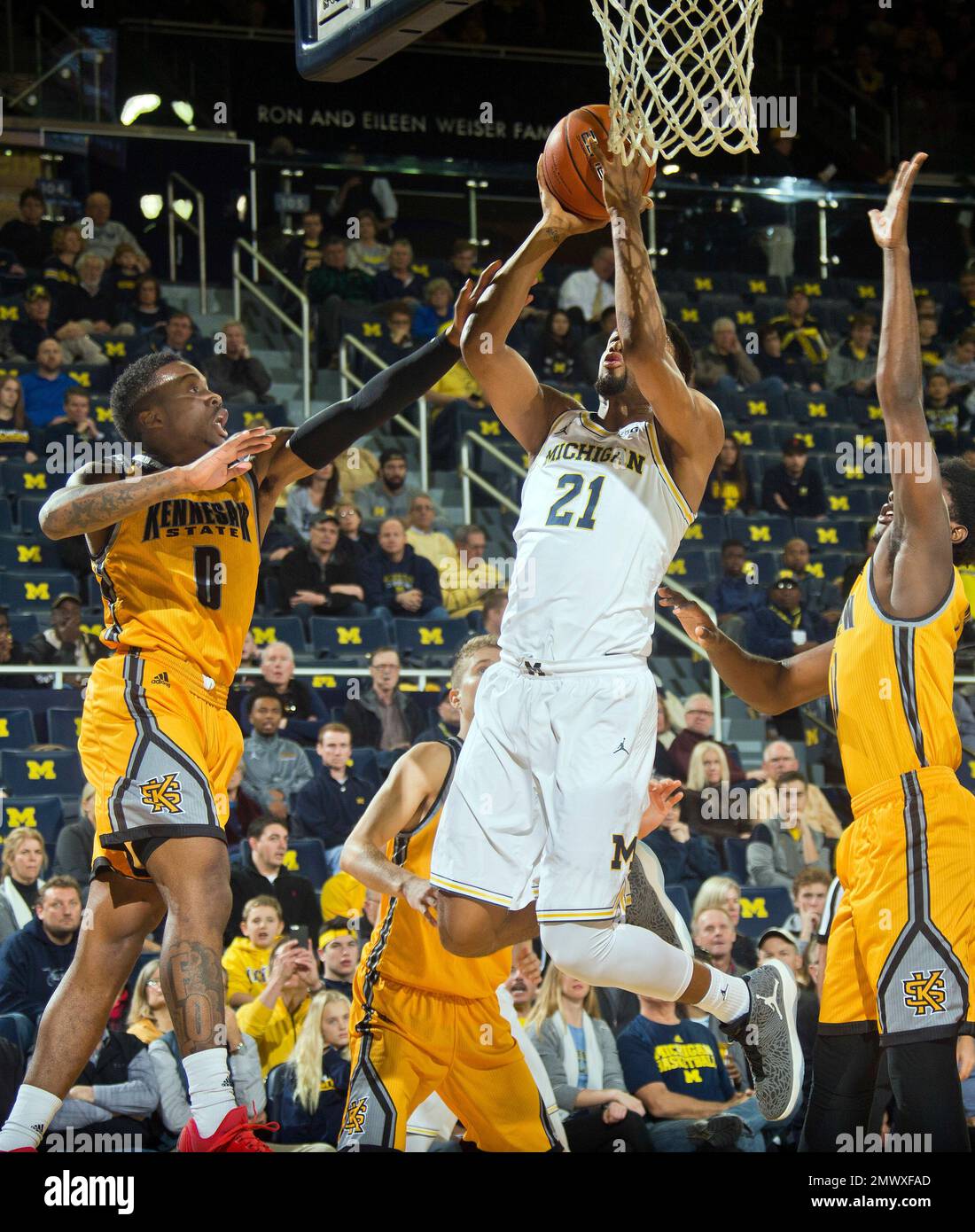 Kennesaw State guard Kendrick Ray (0) defends as Michigan guard Zak ...