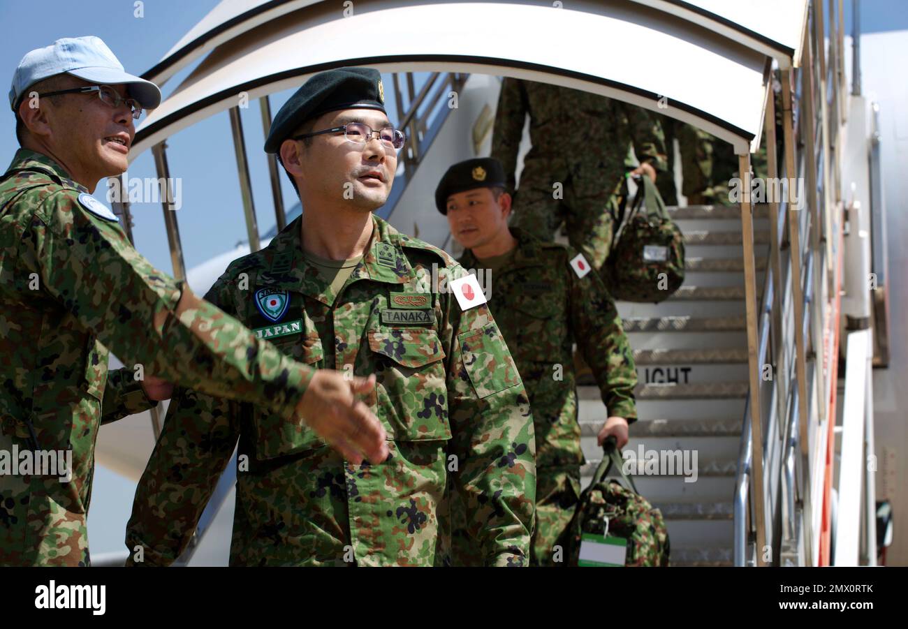 Squad leader Captain Yoshino Tanaka, center-left, and other members of ...