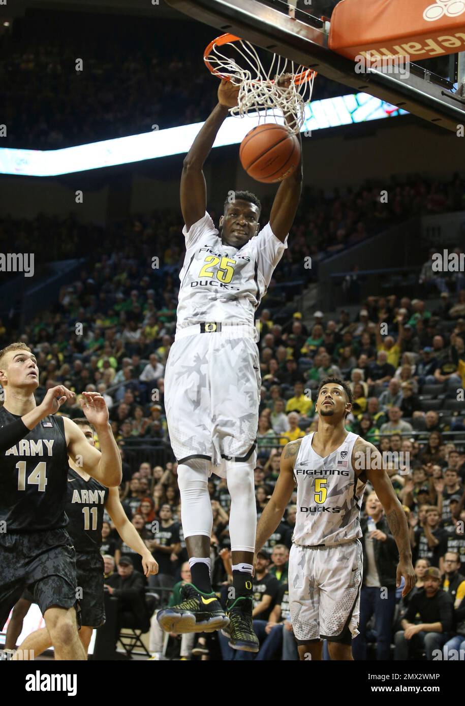 Army's Matthew Wilson, left, watches as Oregon's Chris Boucher, center ...