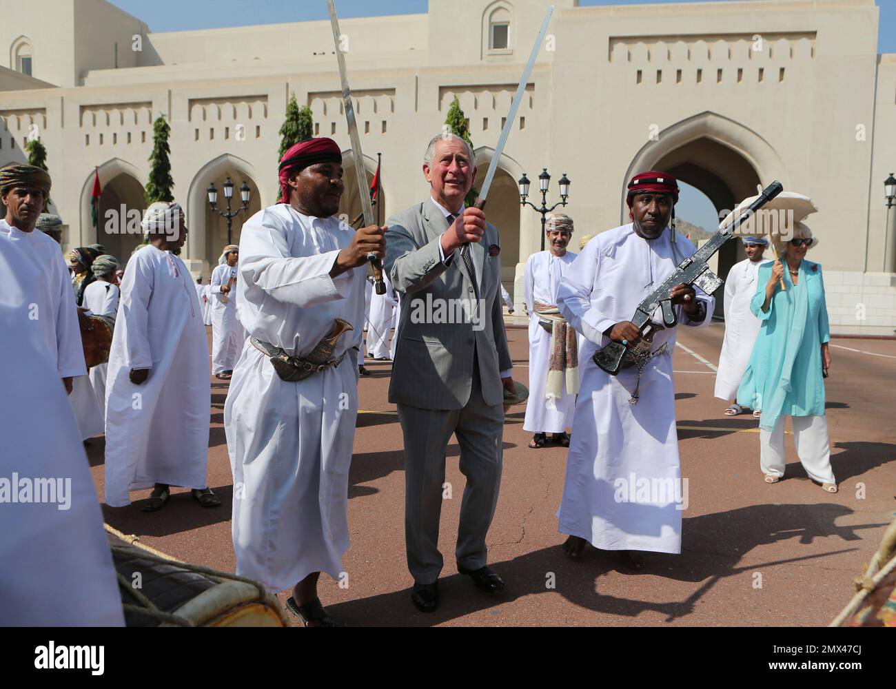 Britain's Prince Charles center, dances with a sword with a group of ...