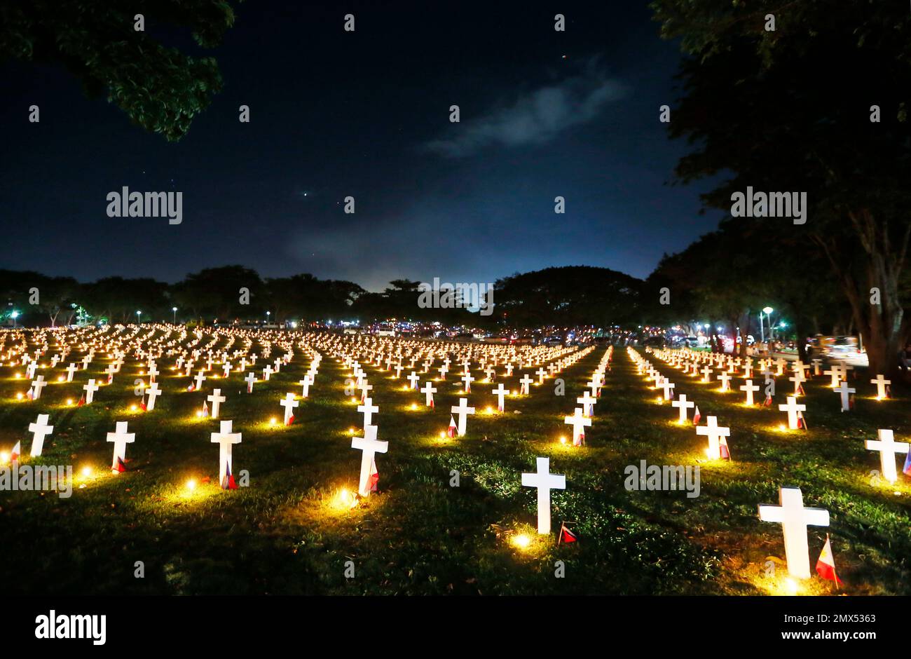 Thousands of crosses are lit with candles to pay tribute to the ...