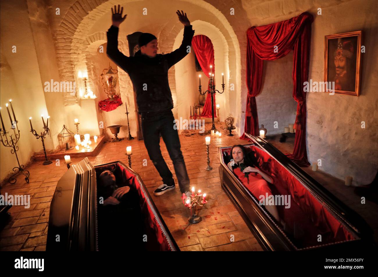 A technician gestures as Tami Varma, right, and her brother Robin, the ...