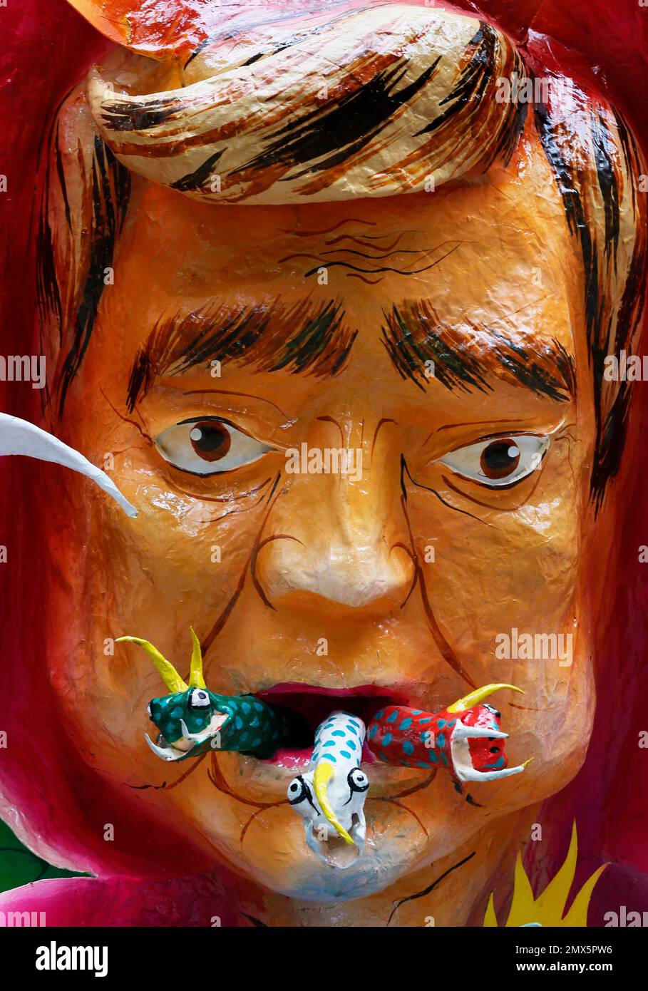 A sculpture depicts Donald Trump in the belly of a giant dragon ...