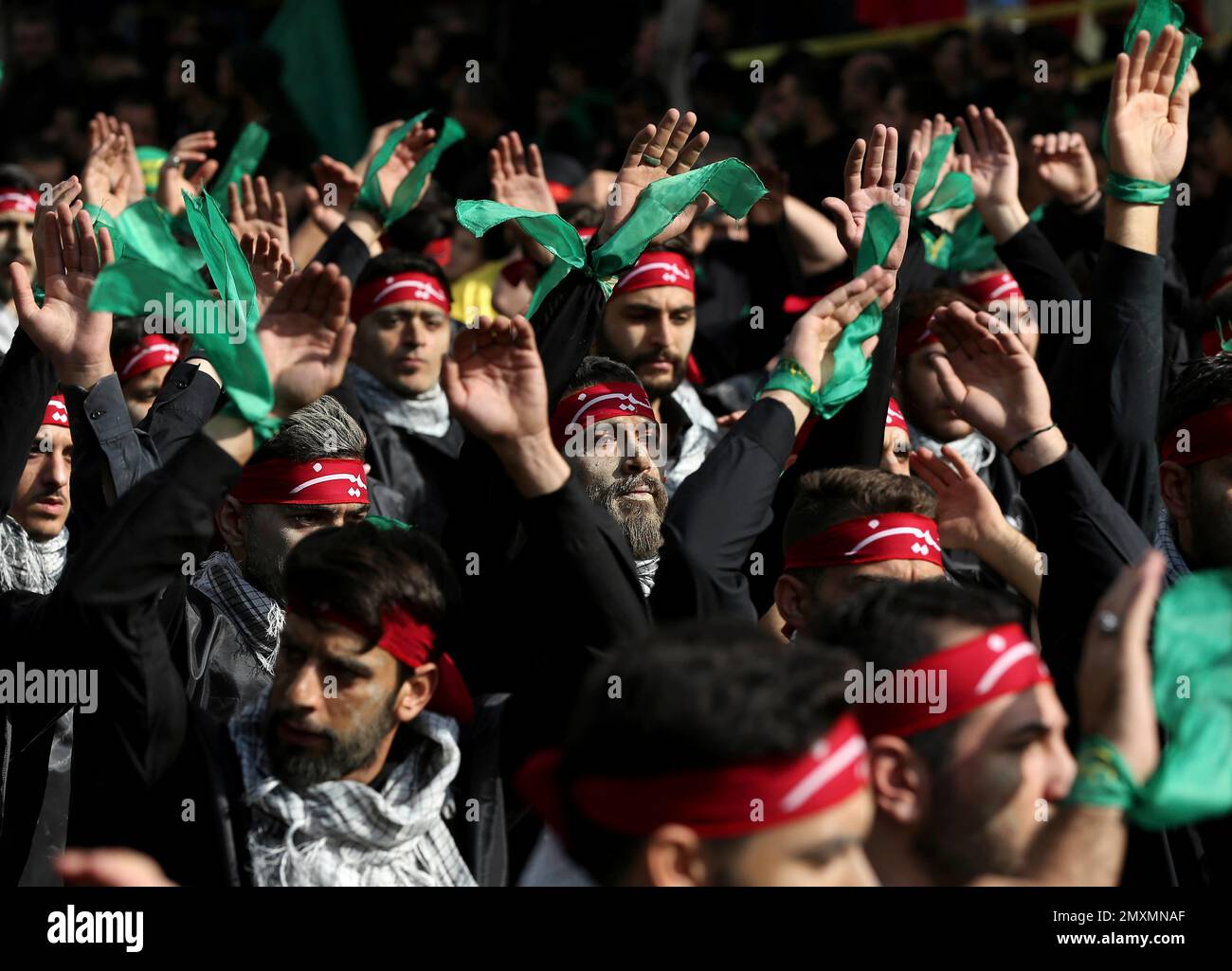 Lebanese Shiite supporters of Iranian-backed Hezbollah group, raise up ...