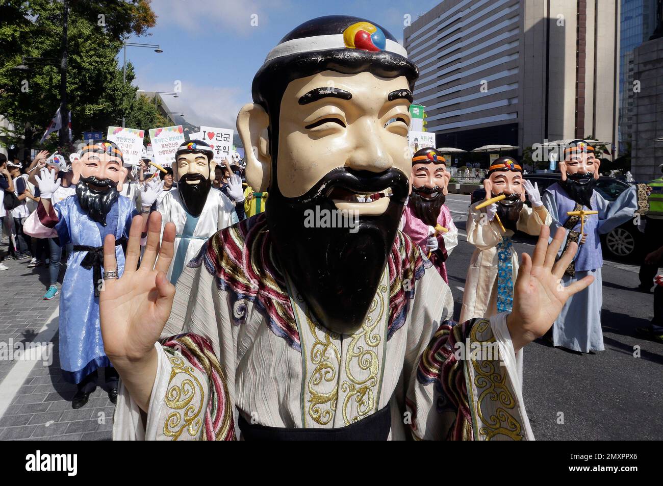 South Koreans wearing masks of Dangun, the legendary founder of ...