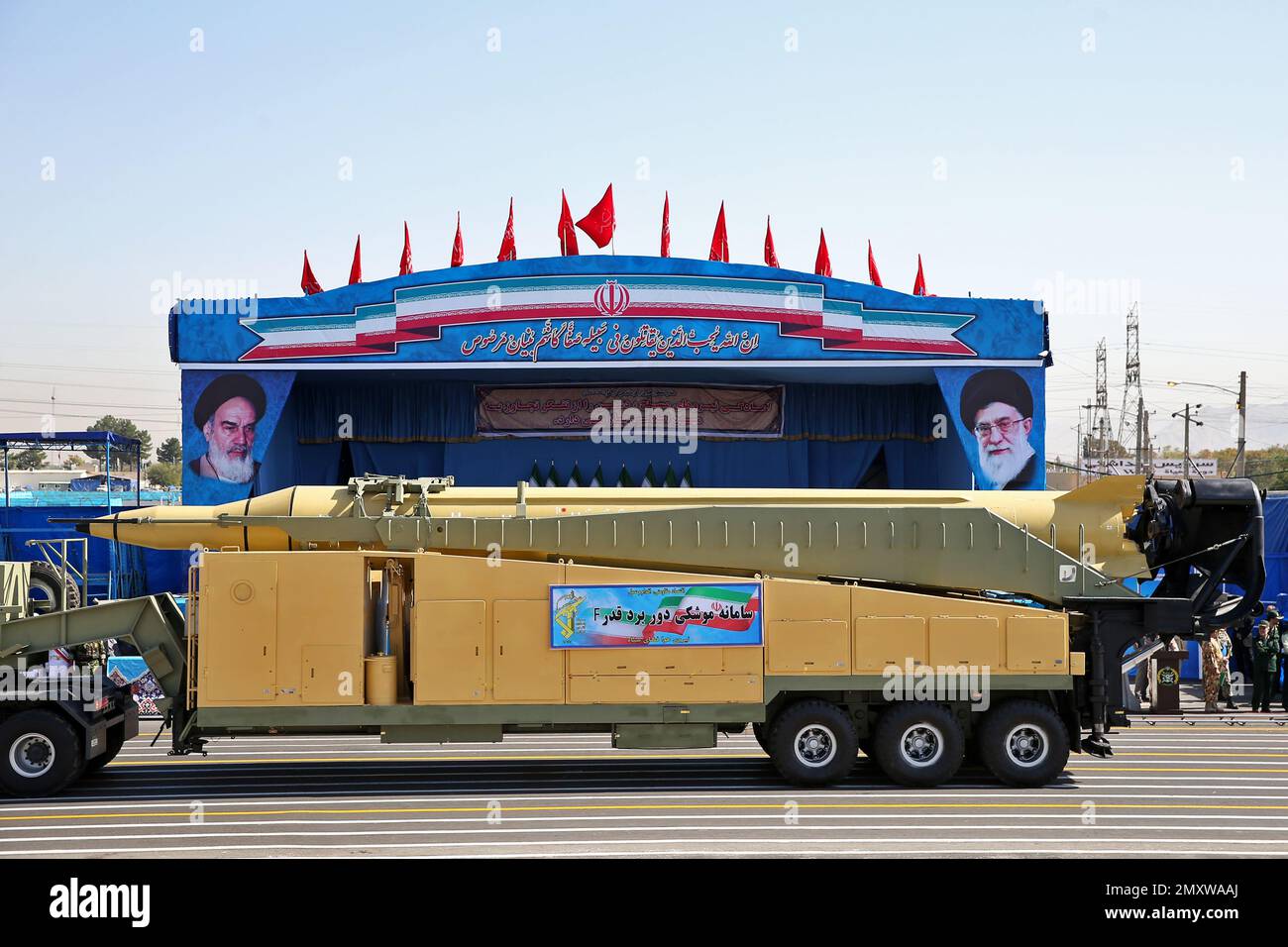 In front of the portraits of supreme leader Ayatollah Ali Khamenei ...