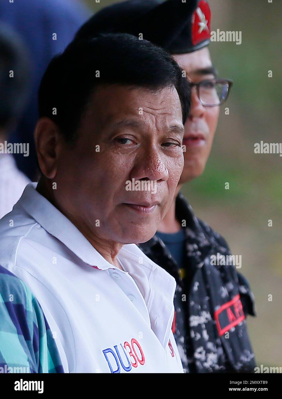 Philippine President Rodrigo Duterte glances at Philippine Army Scout ...