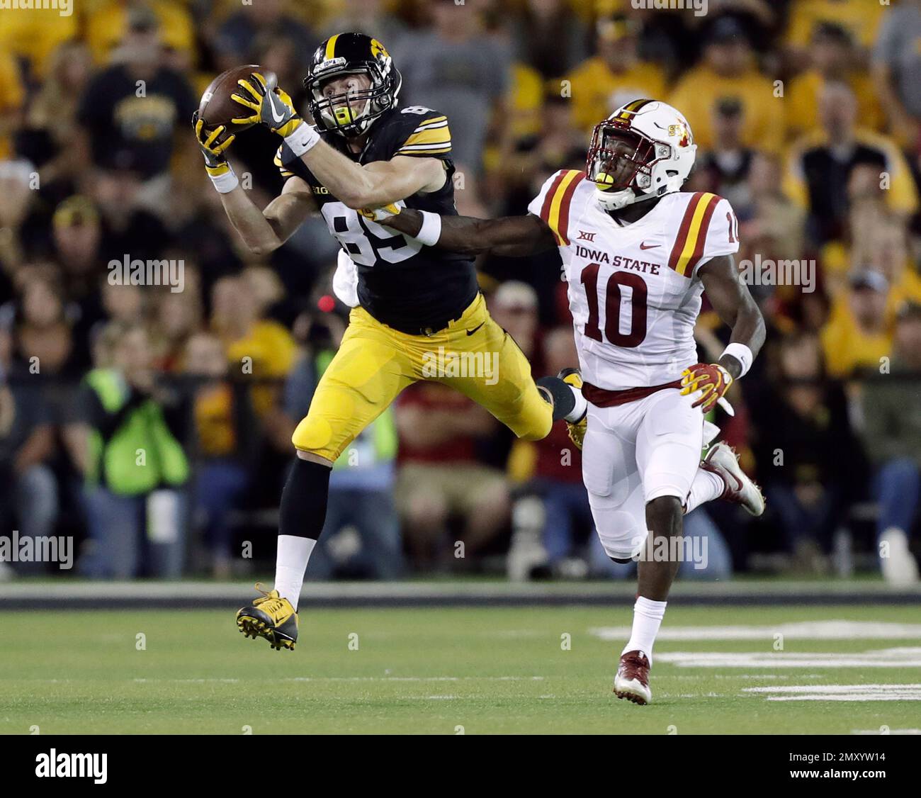 Iowa wide receiver Matt VandeBerg catches a pass next to Iowa State ...