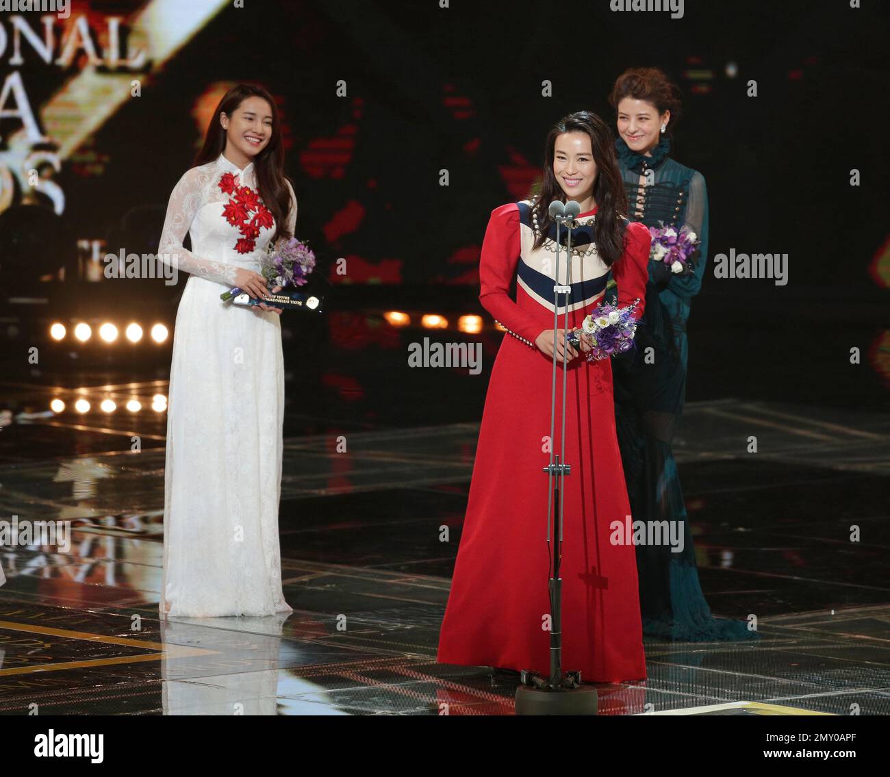 Singaporean actress Rebecca Lim, center, speaks as Japanese actress ...