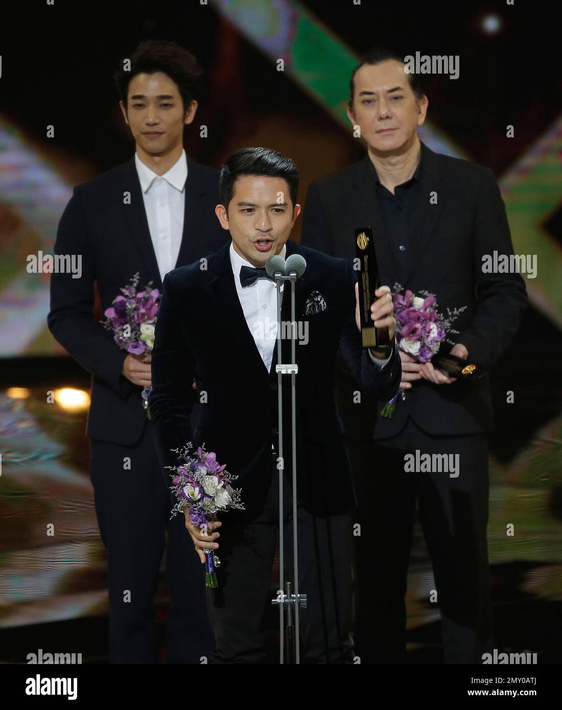 Filipino actor Dennis Trillo, center, speaks as Taiwanese actor Liu Yi ...