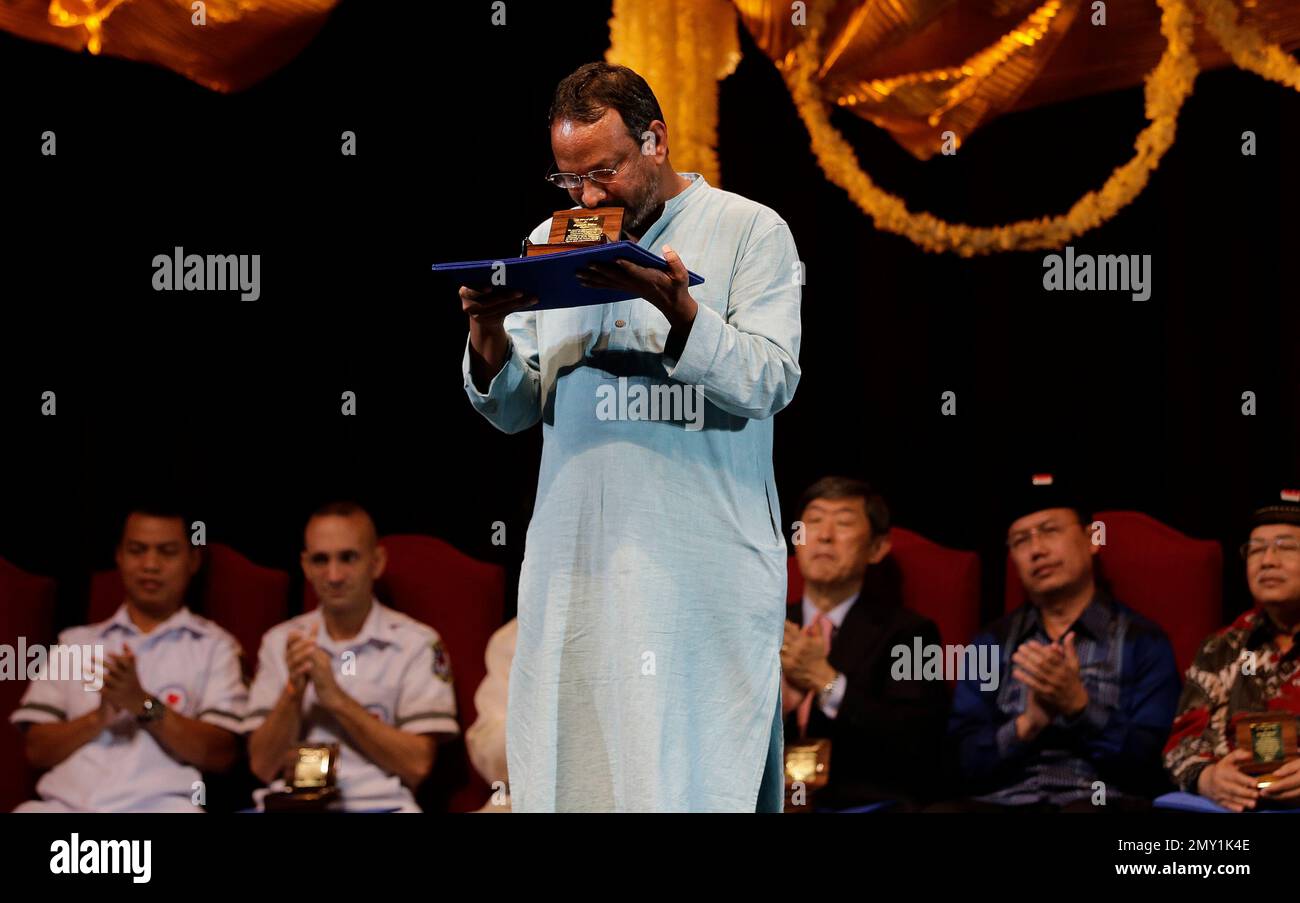 2016 Ramon Magsaysay awardee Indian activist Bezwada Wilson kisses his ...