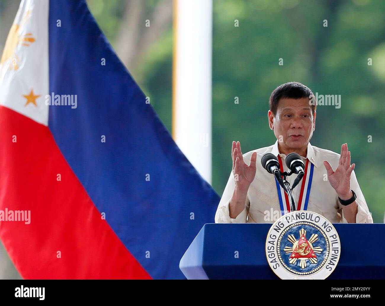 Philippine President Rodrigo Duterte gestures while speaking following ...