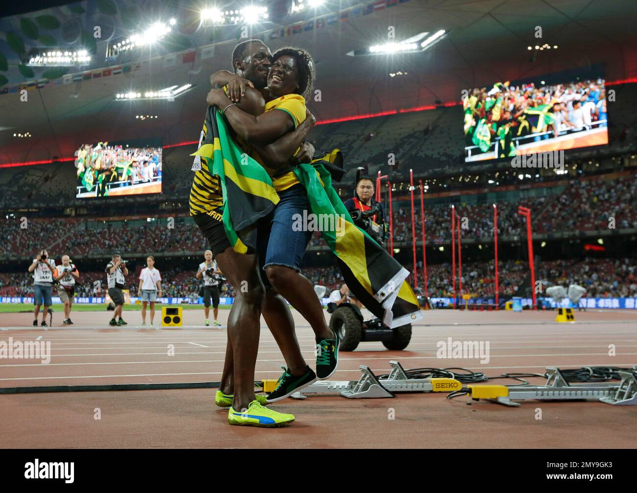 FILE - In this Aug. 23, 2015 file photo, Jamaica's Usain Bolt hugs his ...