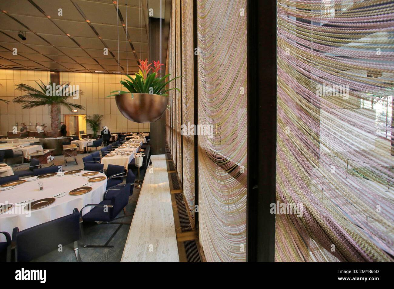In this July 12, 2016 photo, chain link curtains created by textile ...