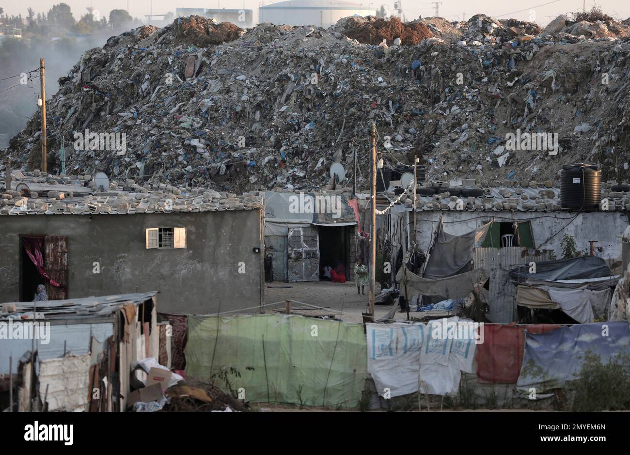 In this Monday, June 20, 2016 photo, piles of garbage surround el-Zohor ...