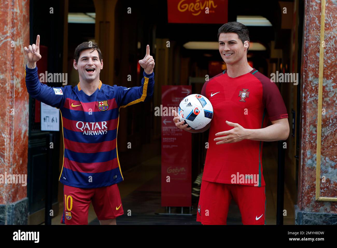 The life-size wax figure of Barcelona's Lionel Messi, left, and Real Madrid's Cristiano Ronaldo ...