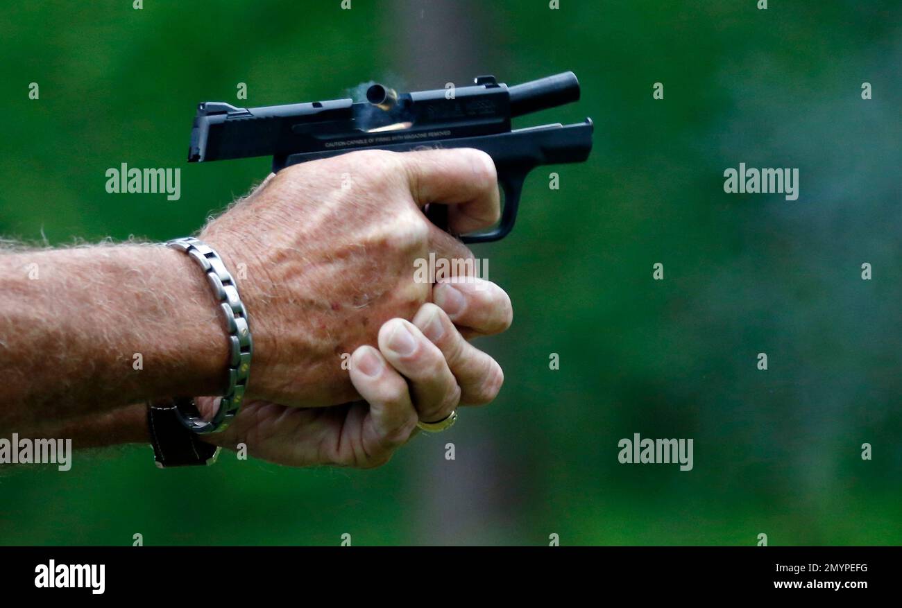 In this April 30, 2016 photograph, a new round is chambered in a ...