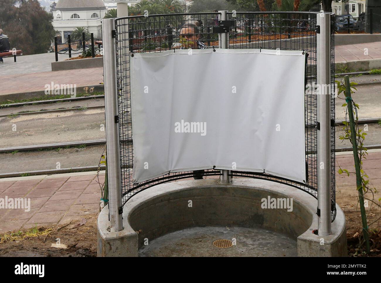 FILE - In this Jan. 28, 2016 file photo, a woman looks at the fencing ...