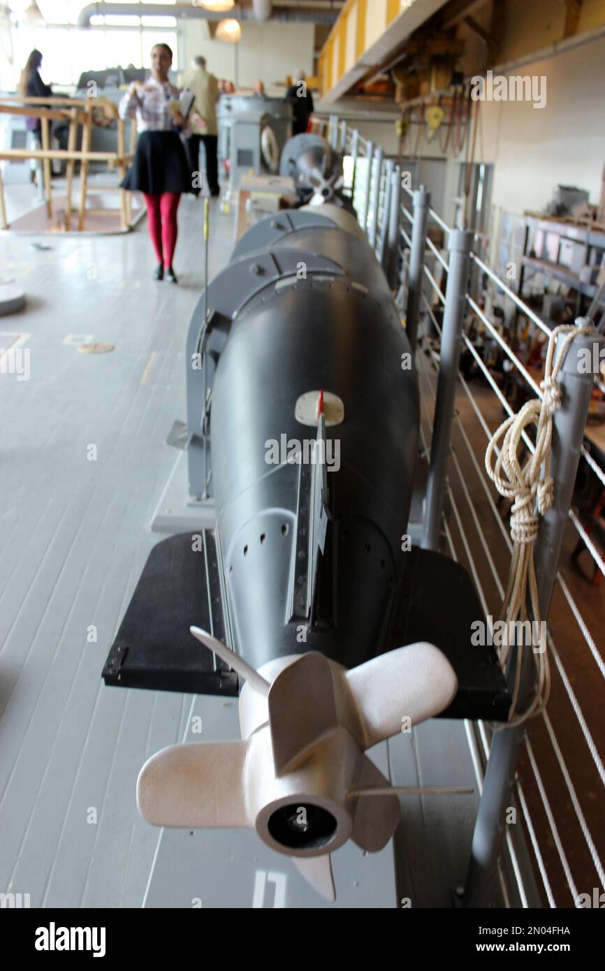 A torpedo sits on the deck of PT-305, a World War II patrol torpedo ...